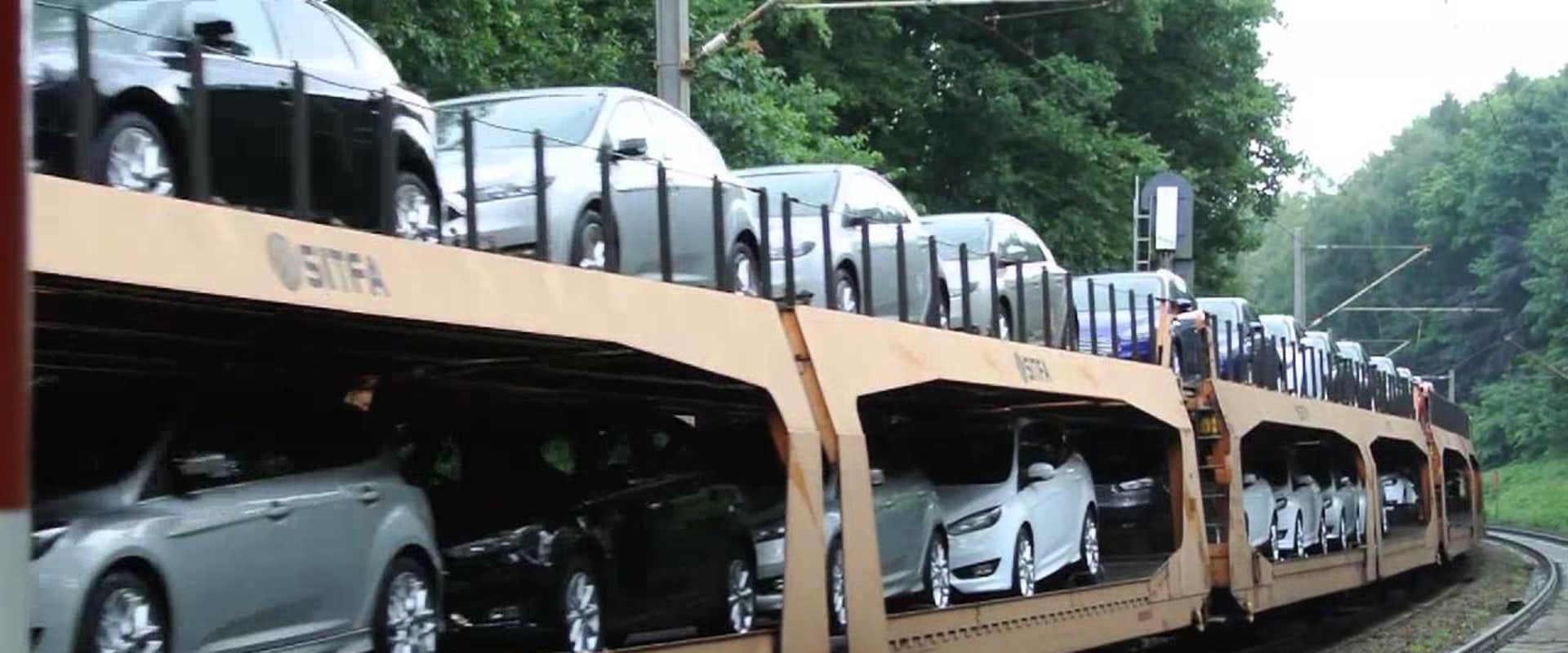 Transporting Cars on Trains or Freight Cars